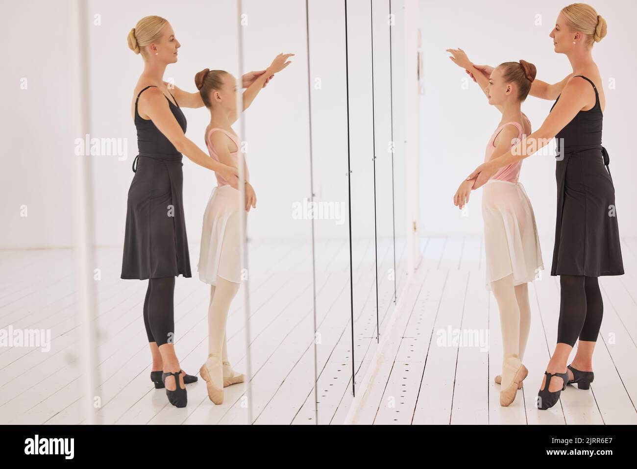 Ballet education, teacher and girl dancer learning on mirror from her ...