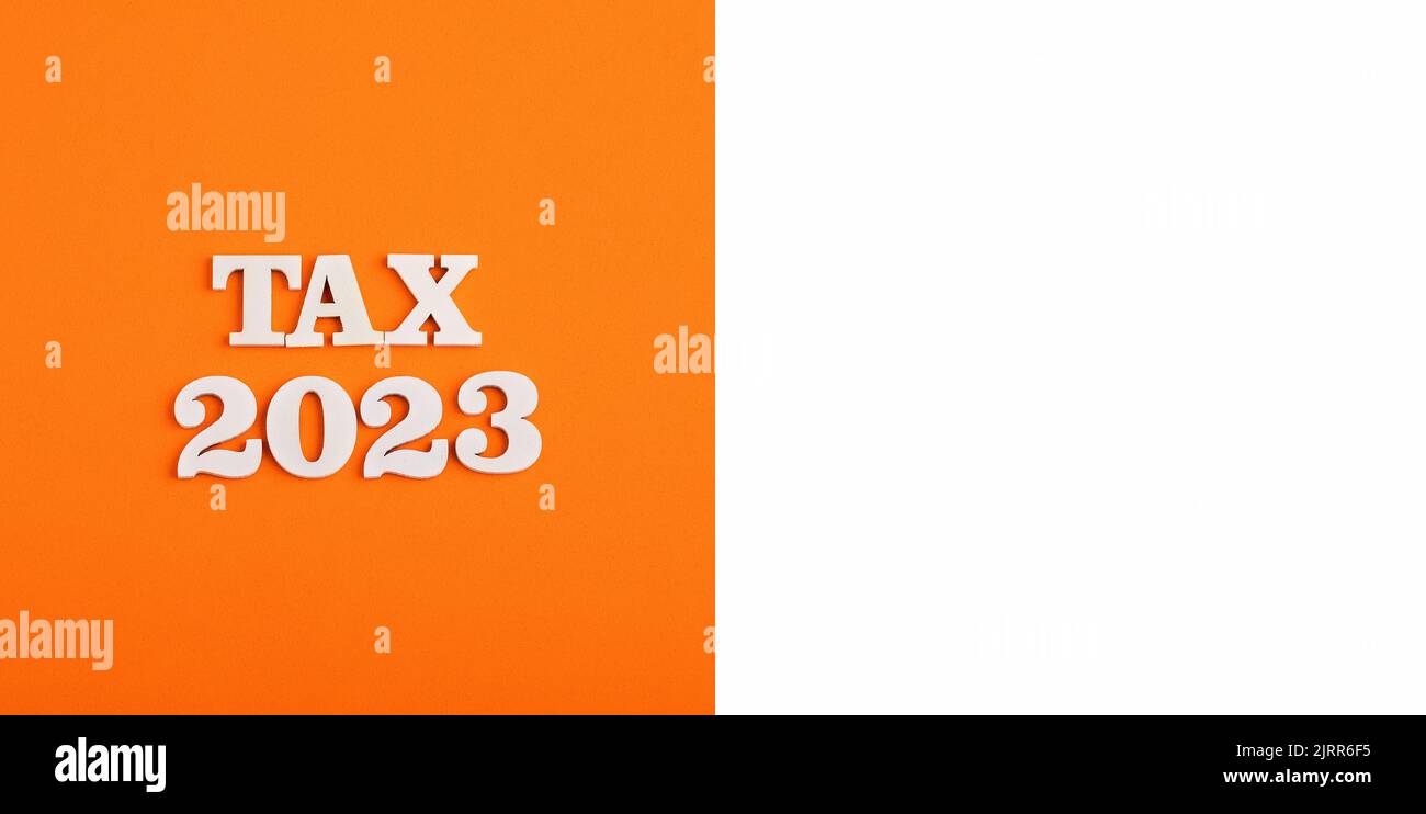 Taxes for the year 2023 - Concept. White numbers on orange background ...