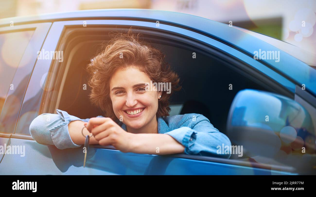 Happiness is, getting your very first car. a happy young woman holding ...
