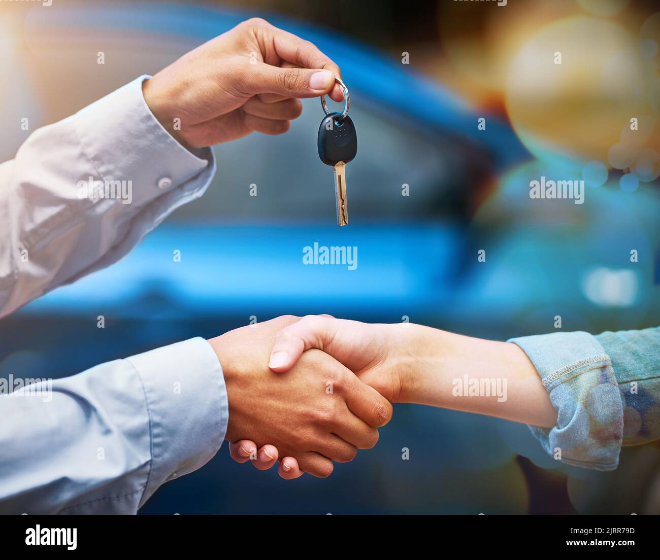 The car is all yours. a man handing a woman the keys to her new car ...