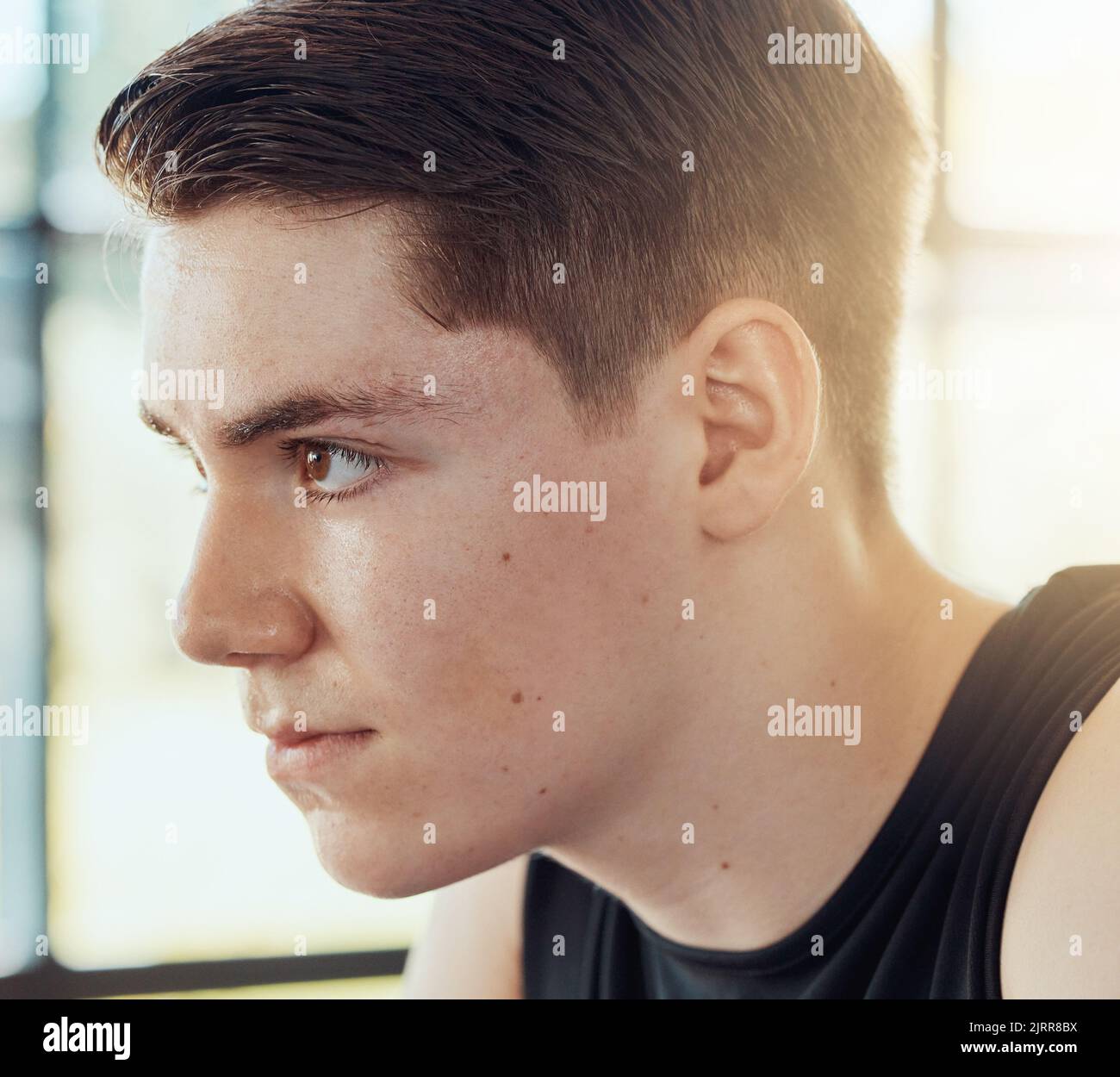 Thinking man face with motivation and focus in a room alone while ...