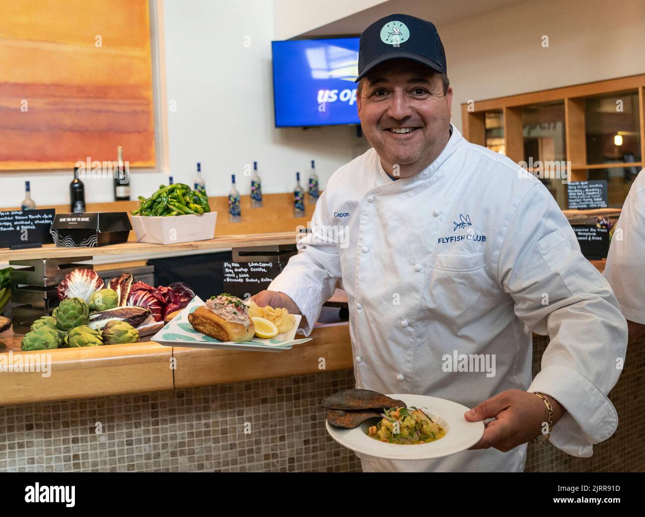 New Yokr, NY - August 25, 2022: Celebrity chef Josh Capon holds dishes ...