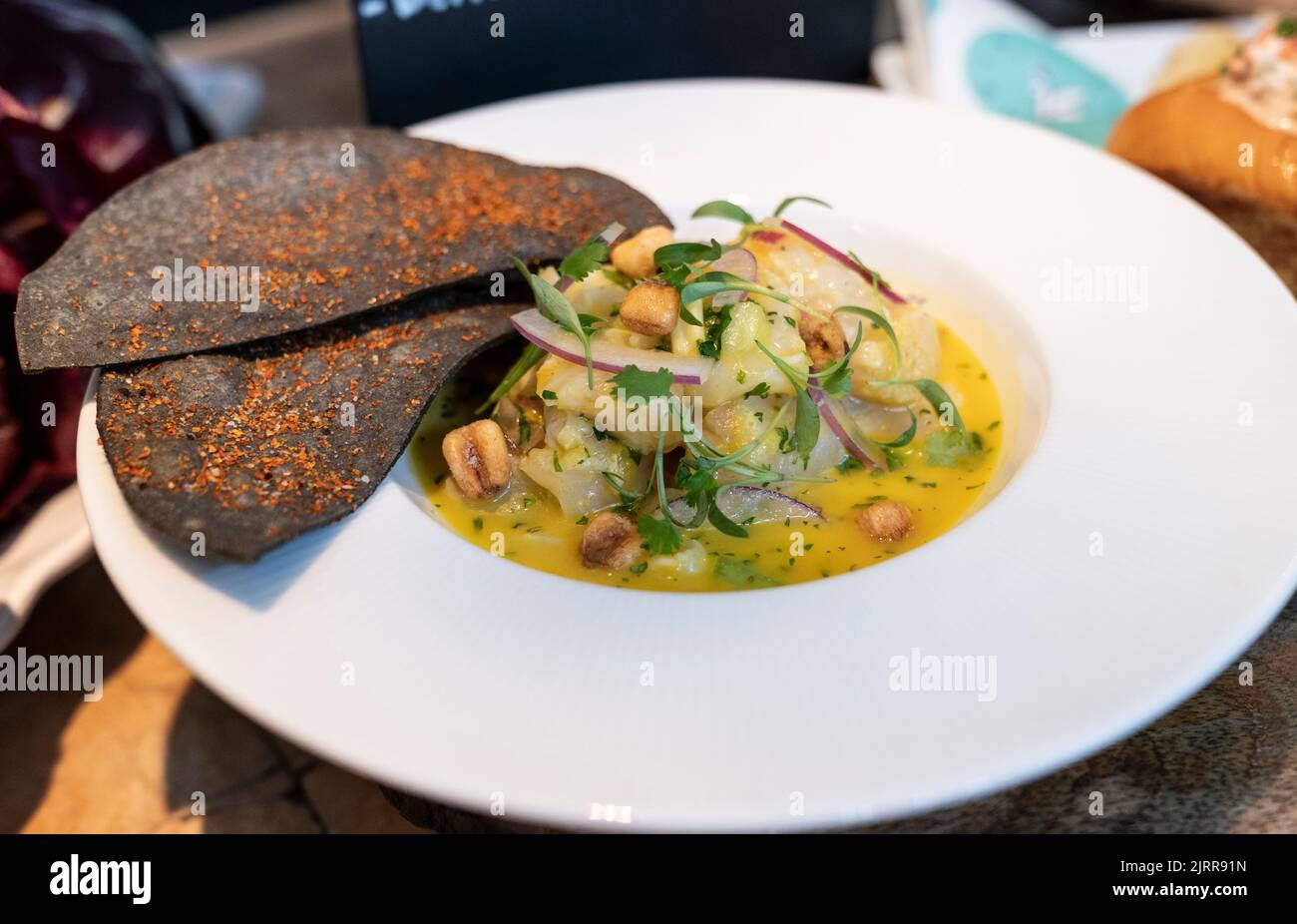 New Yokr, NY - August 25, 2022: Bay scallops by Josh Capon on display ...