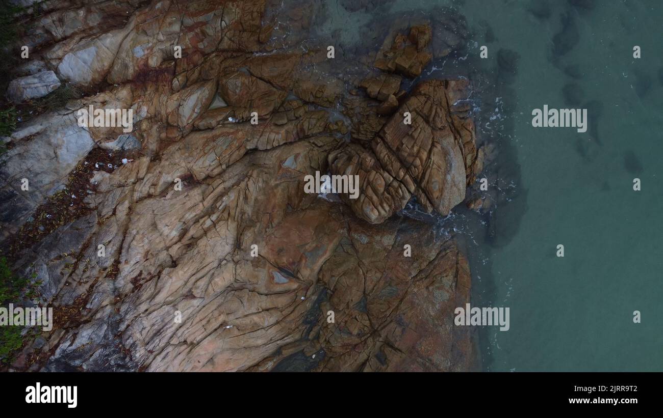 aerial scene of boulders along the sandy beach Stock Photo - Alamy