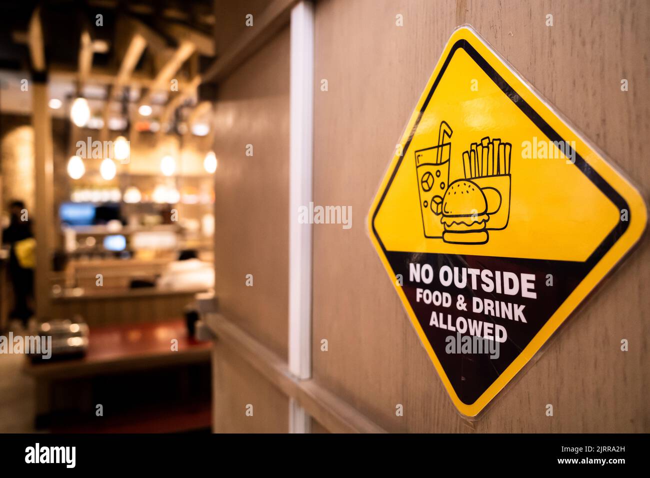 No outside food and drink allowed text on black and yellow restriction ...