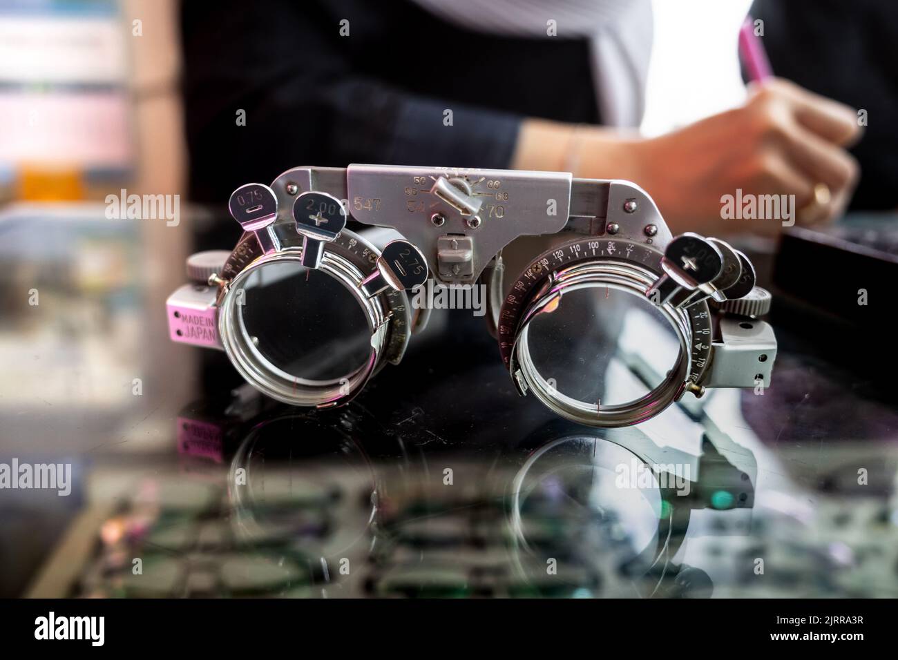 Phoropter for vision correction test on table at eyeglasses store Stock ...