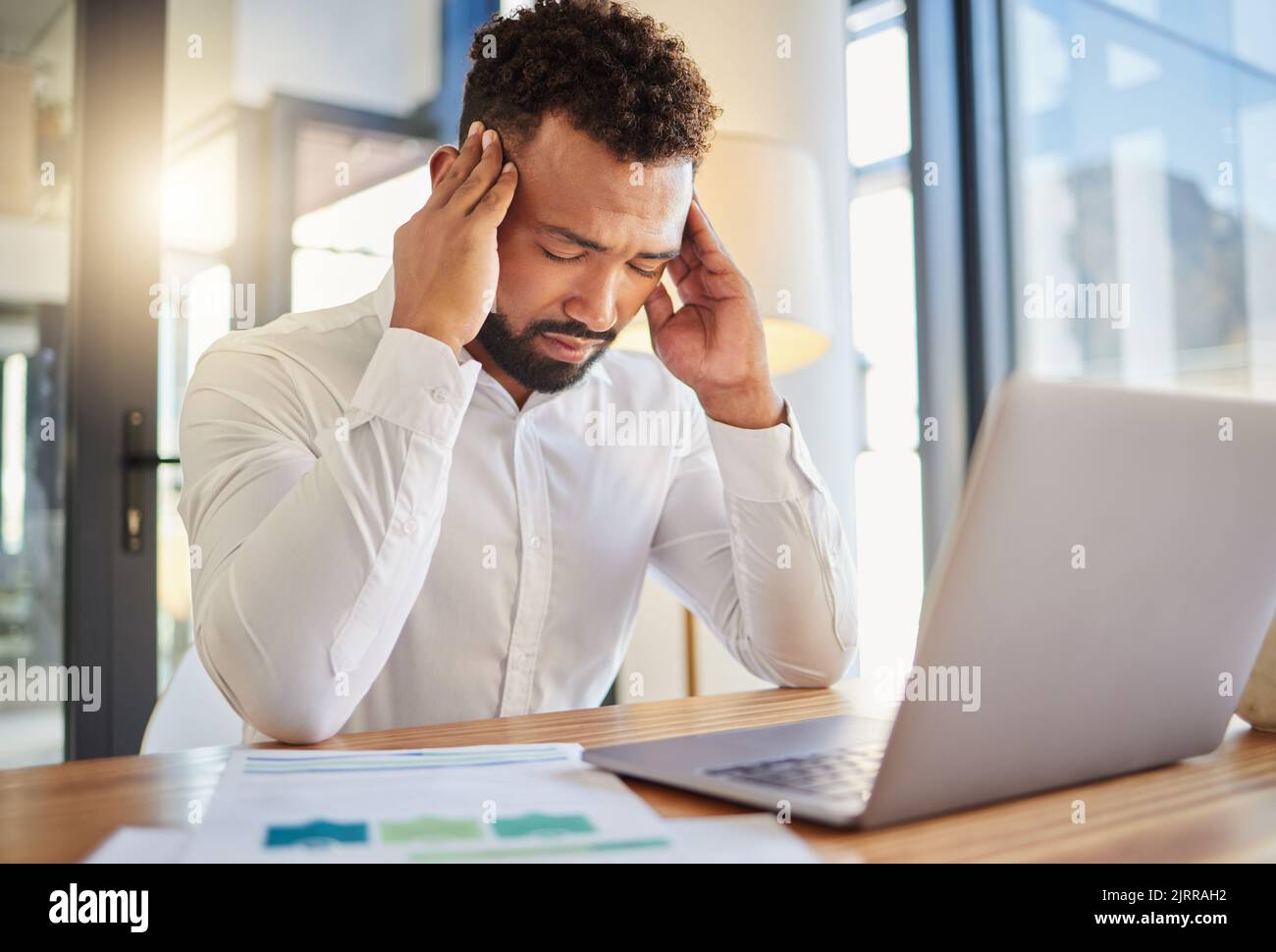 Stress, burnout and headache businessman on laptop with error, problem or frustrated job for ...