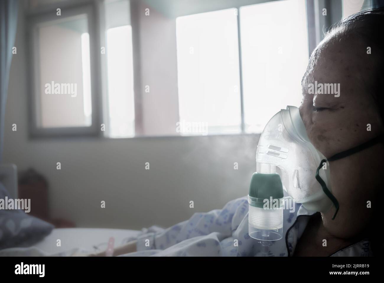 Southeast Asian female elderly patient hospitalized and undergoing ...