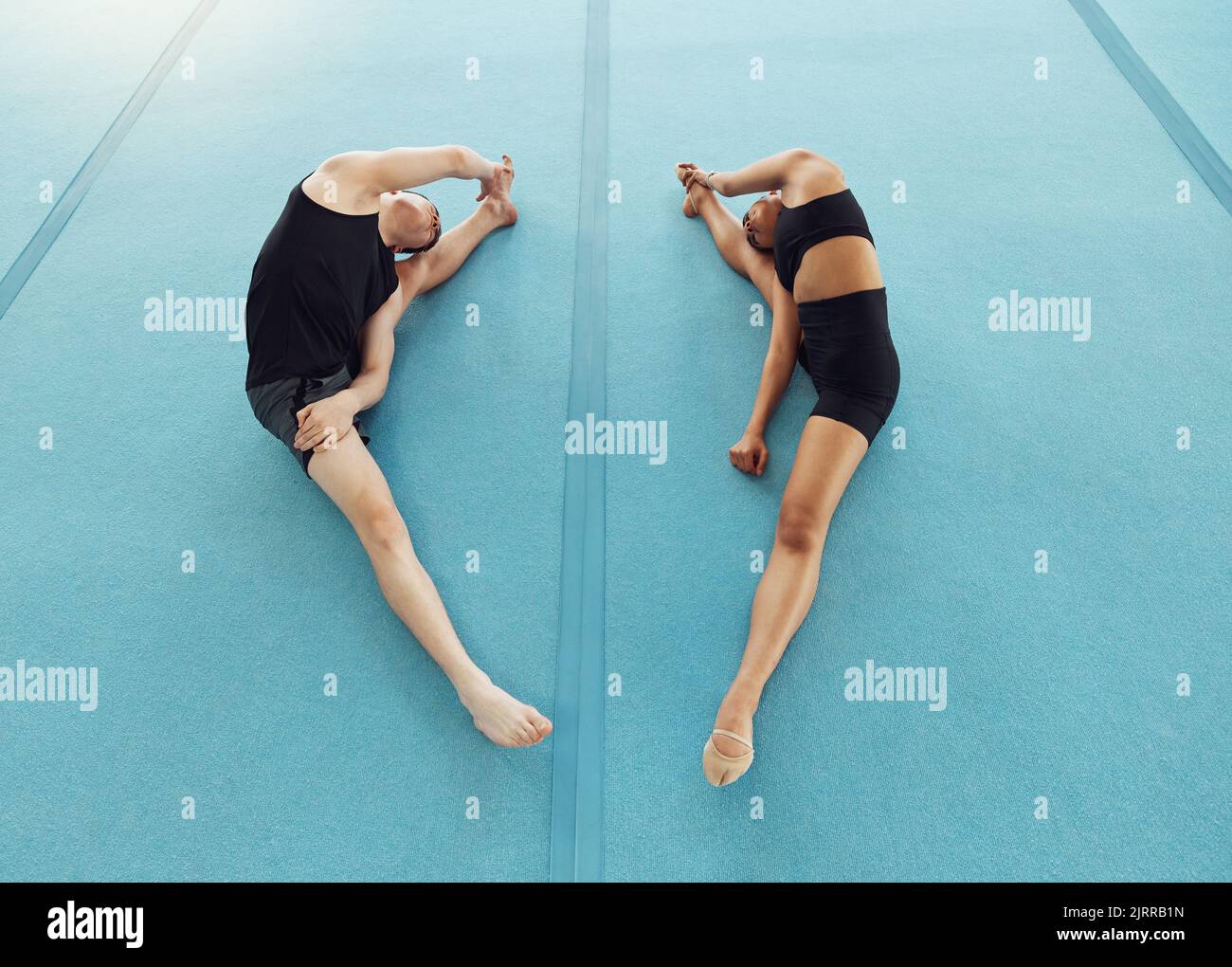 Gymnastics, fitness and people training in a gym stretching and ...