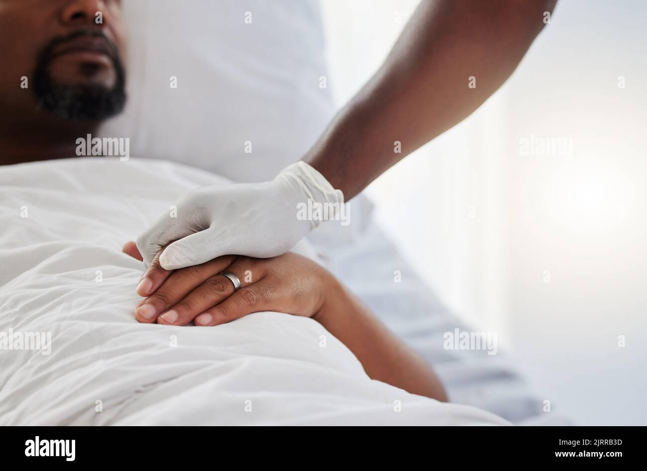 Cancer, death and medical support with a patient and nurse in a ...