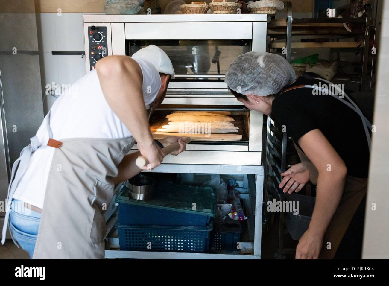The process of making traditional French baguettes in a craft bakery ...