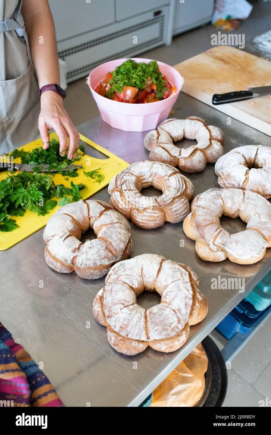 Finished French bread in the bakery on the table. Rustic bread, the ...