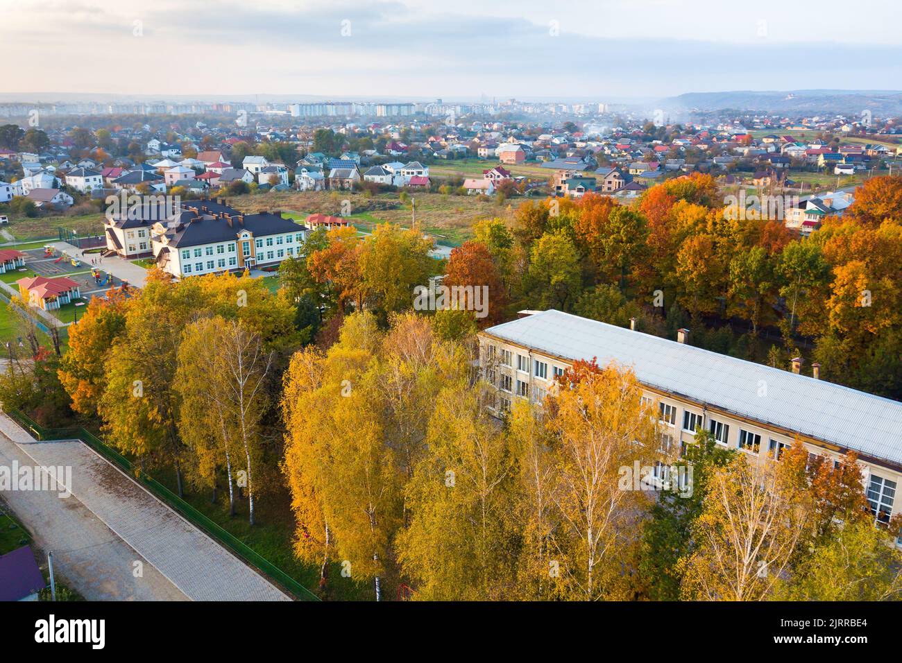 Aerial view of school, college or kindergarten building with big yard ...