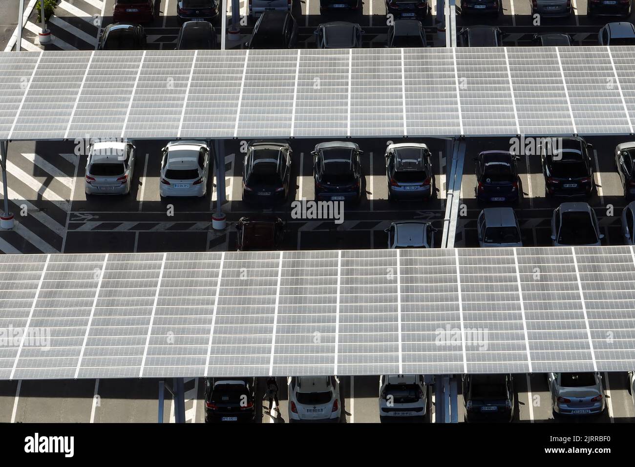 Aerial view of solar panels installed as shade roof over parking lot ...