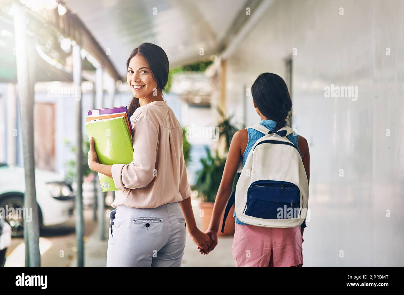 Ill get her to class on time. Portrait of an attractive young teacher ...