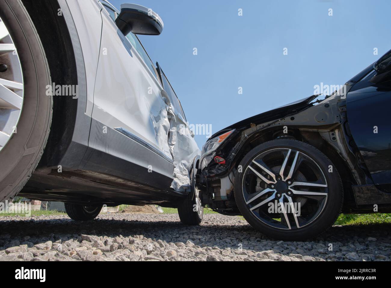 Damaged in heavy car accident vehicles after collision on city street ...
