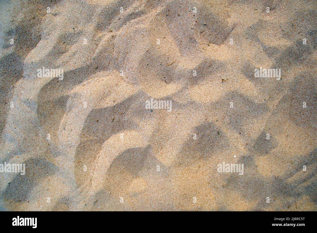 Flat view of clean yellow sand surface covering seaside beach. Sandy ...