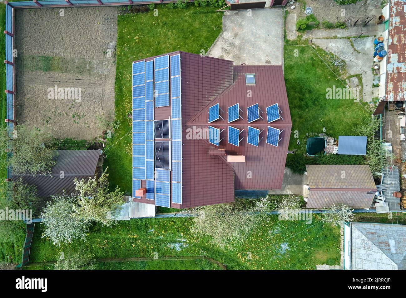 Residential house with rooftop covered with solar photovoltaic panels ...