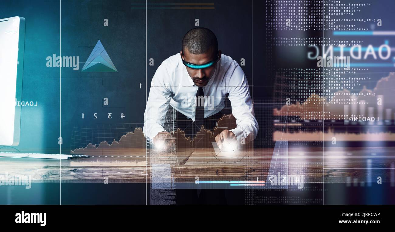 Reaching into new dimensions. a handsome young businessman using a ...