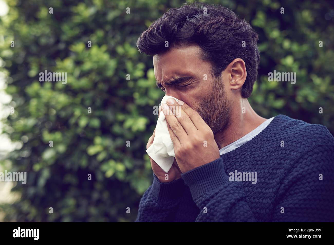 Its the season of sneezes. a young man suffering with allergies Stock ...
