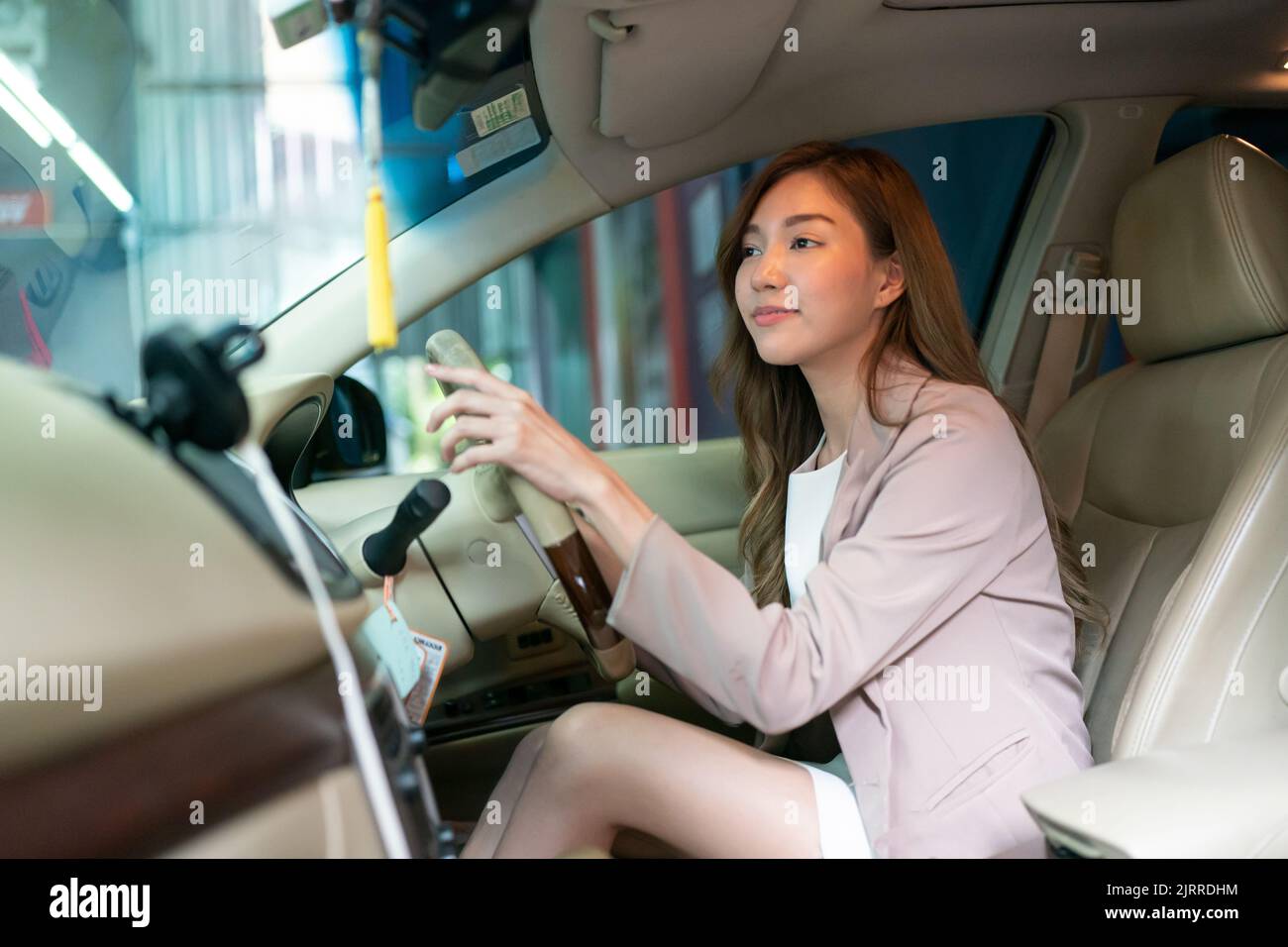 side view of attractive woman driving car alone Stock Photo - Alamy