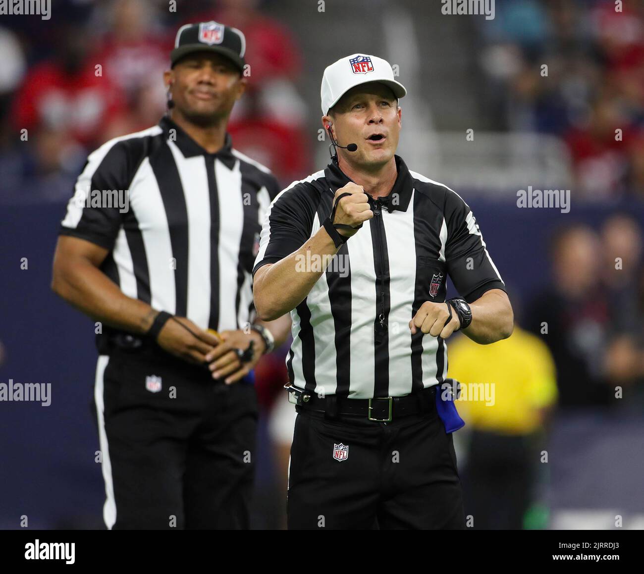 Houston, Texas, USA. 25th Aug, 2022. Referee Shawn Hochuli (83) signals ...
