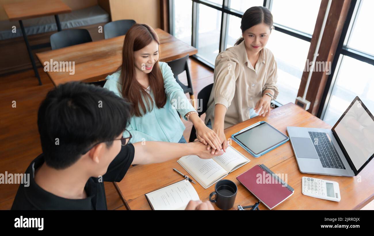 College education concept, Female tutor and students putting hands ...