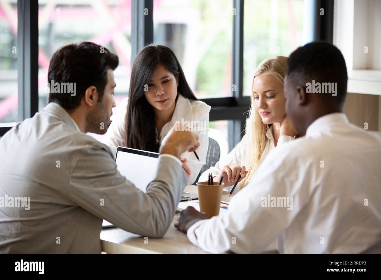 Business partners at meeting in office Stock Photo - Alamy