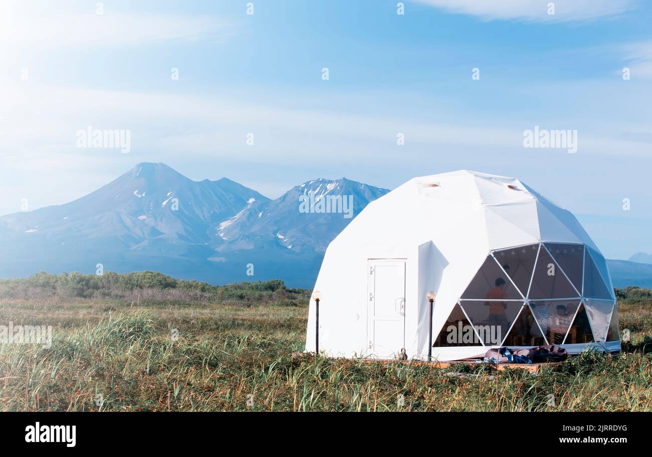 The Glamping house in sunset and volcano, rural landscape, tent houses ...