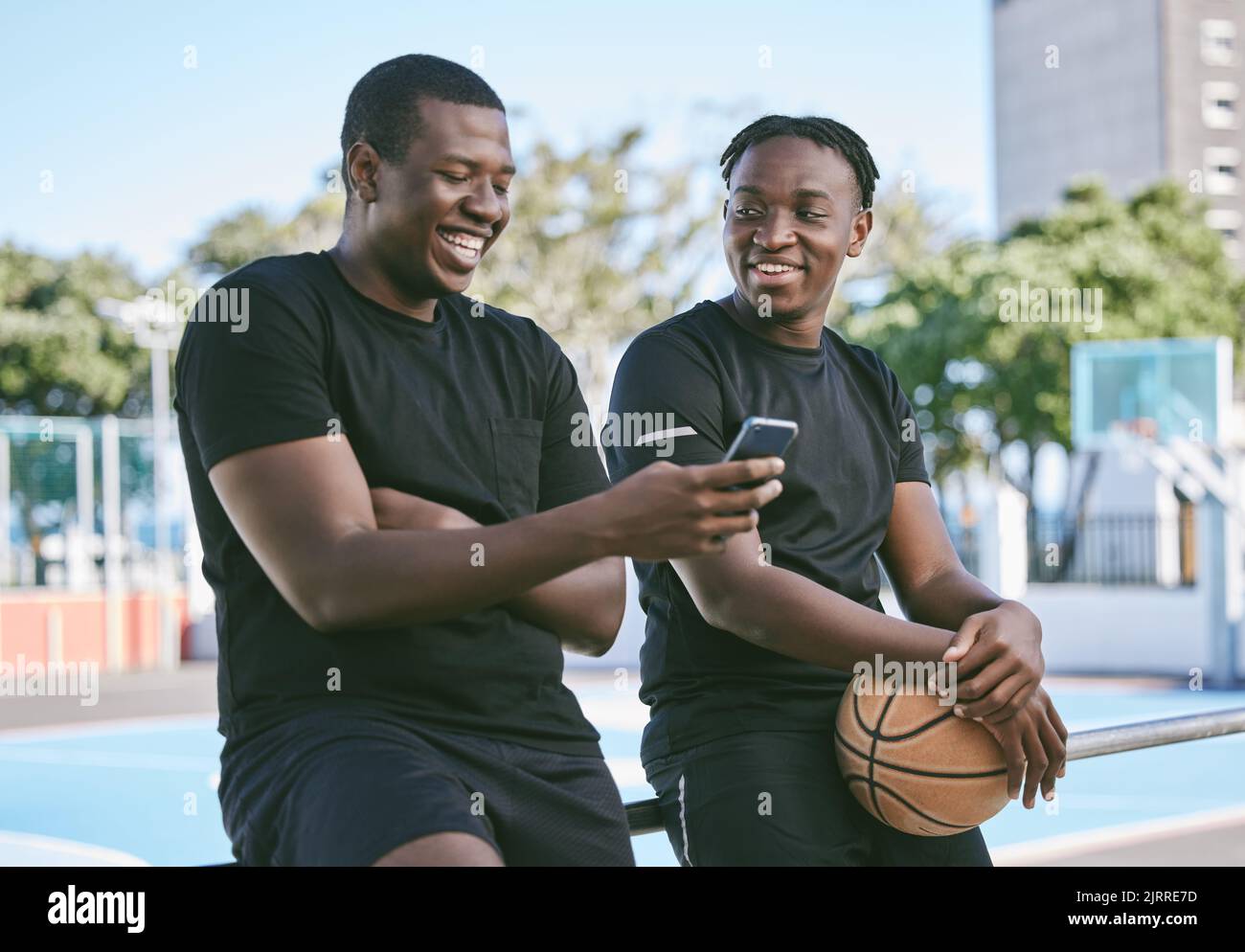 Male brothers on their phone spending time together, siblings or ...