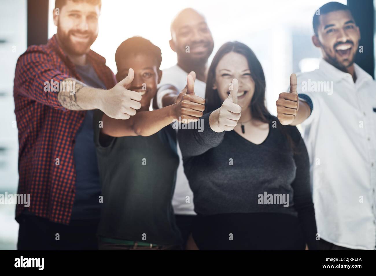 Positivity in unity. Portrait of a team of happy colleagues showing ...