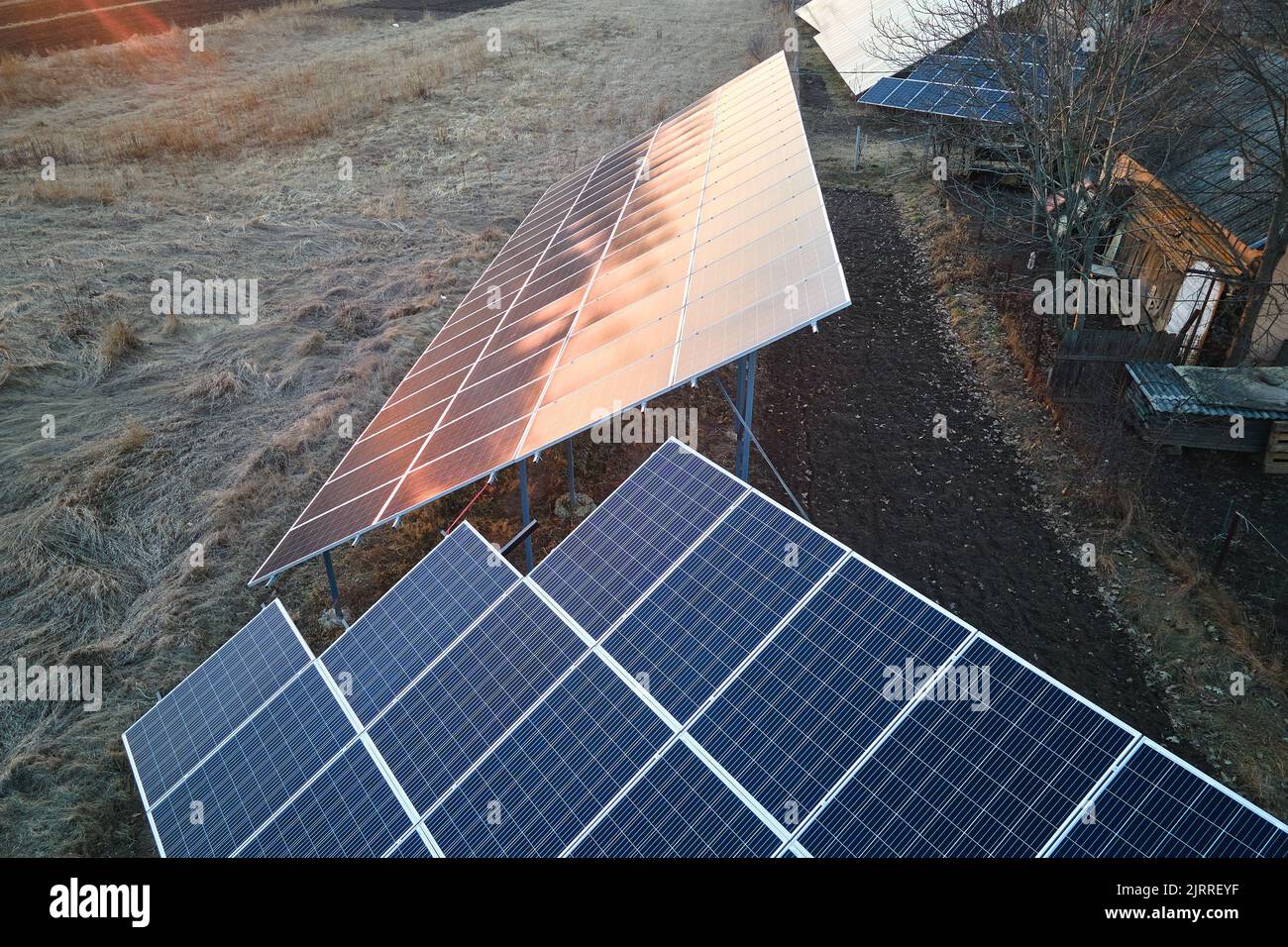 Solar photovoltaic panels mounted on stand-alone frame on backyard ...