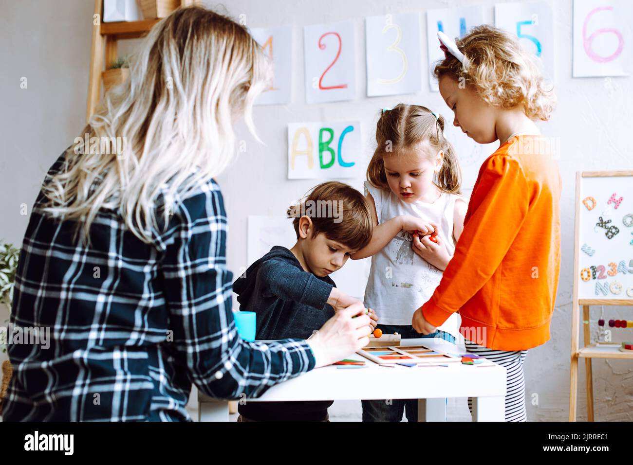 Preschool classroom children table hi-res stock photography and images ...