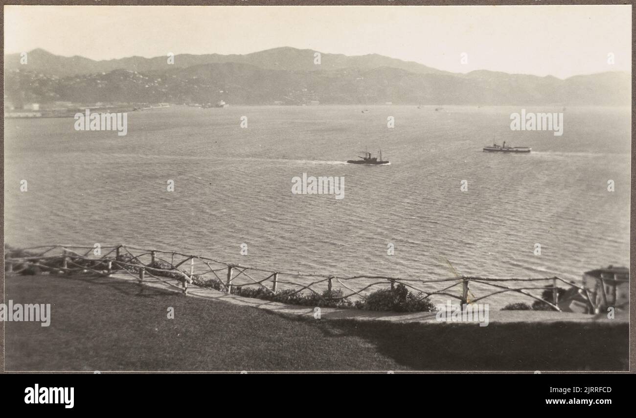 Wellington Harbour (Port Nicholson) with tug and ferry boat passing ...