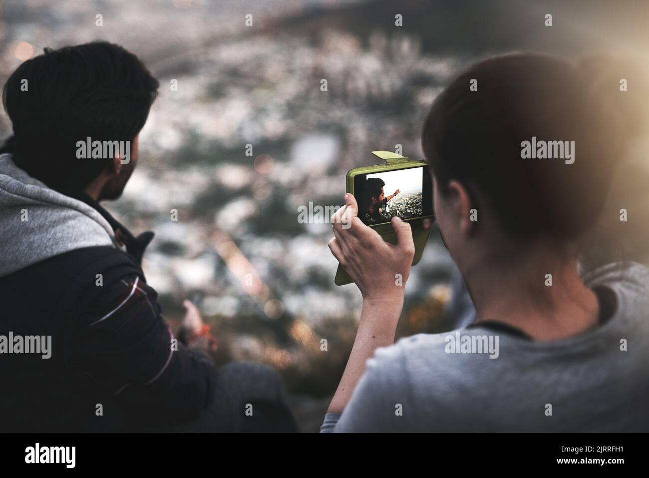 Great views equal great photographs. Rearview shot of a young couple ...