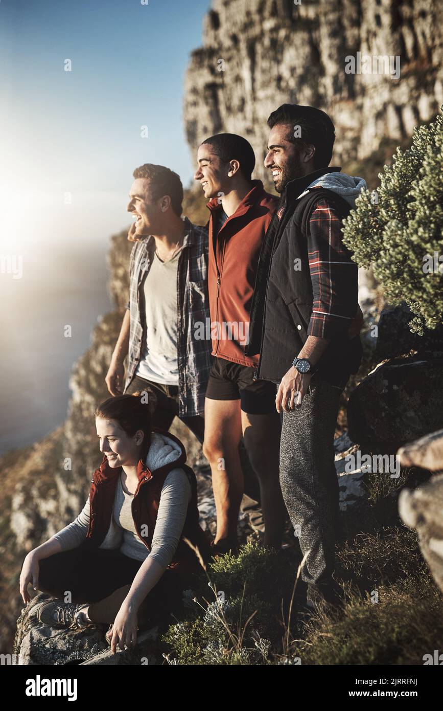 The views from the top are always the best. a group of friends admiring ...