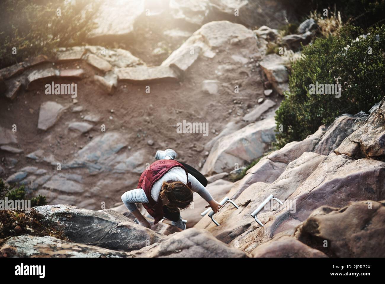 Woman climbing ladder hi-res stock photography and images - Alamy