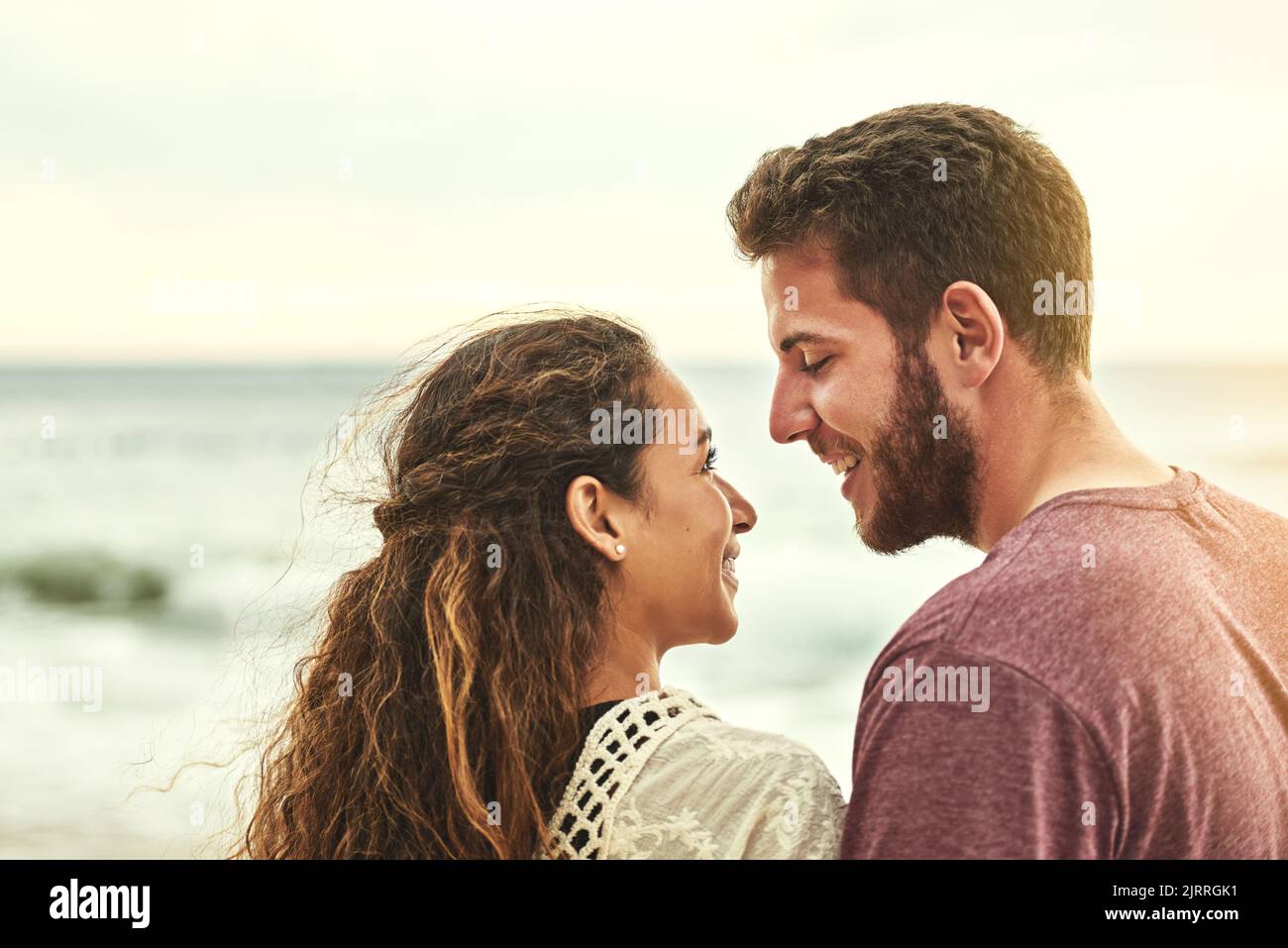 I could get lost in those eyes. an affectionate young couple enjoying ...
