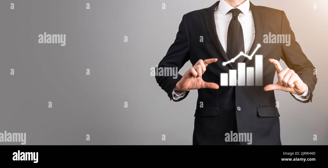 Male hand holding graph icon neon.checking analyzing sales data growth ...