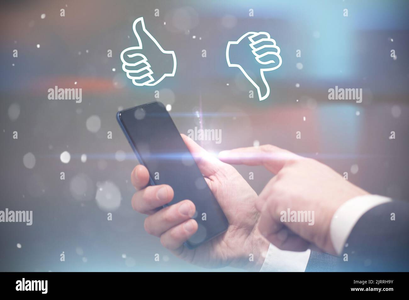 Business person clicking on cellphone with symbol thumb up and thumb ...