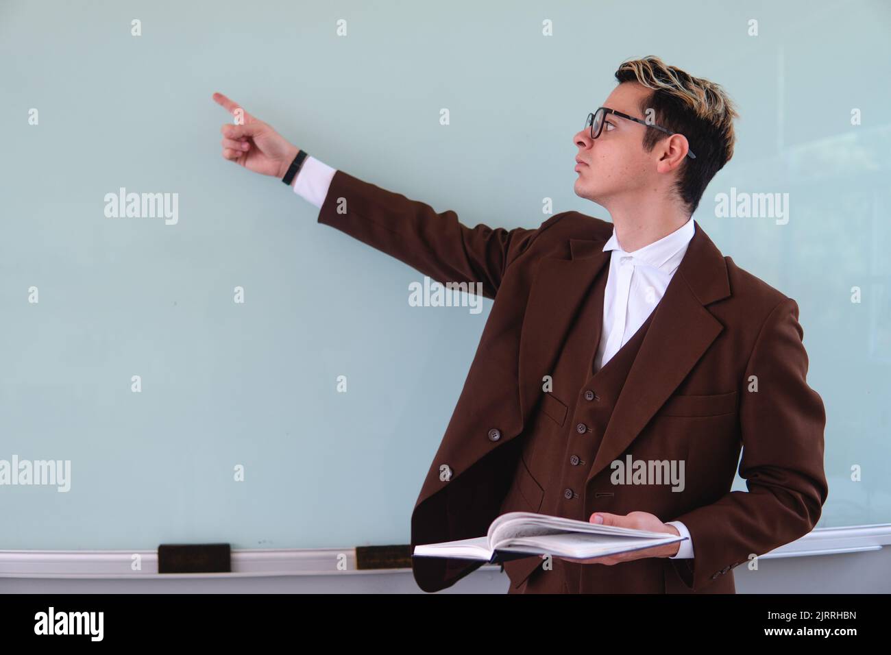 University professor explaining his class. Whiteboard with teacher ...