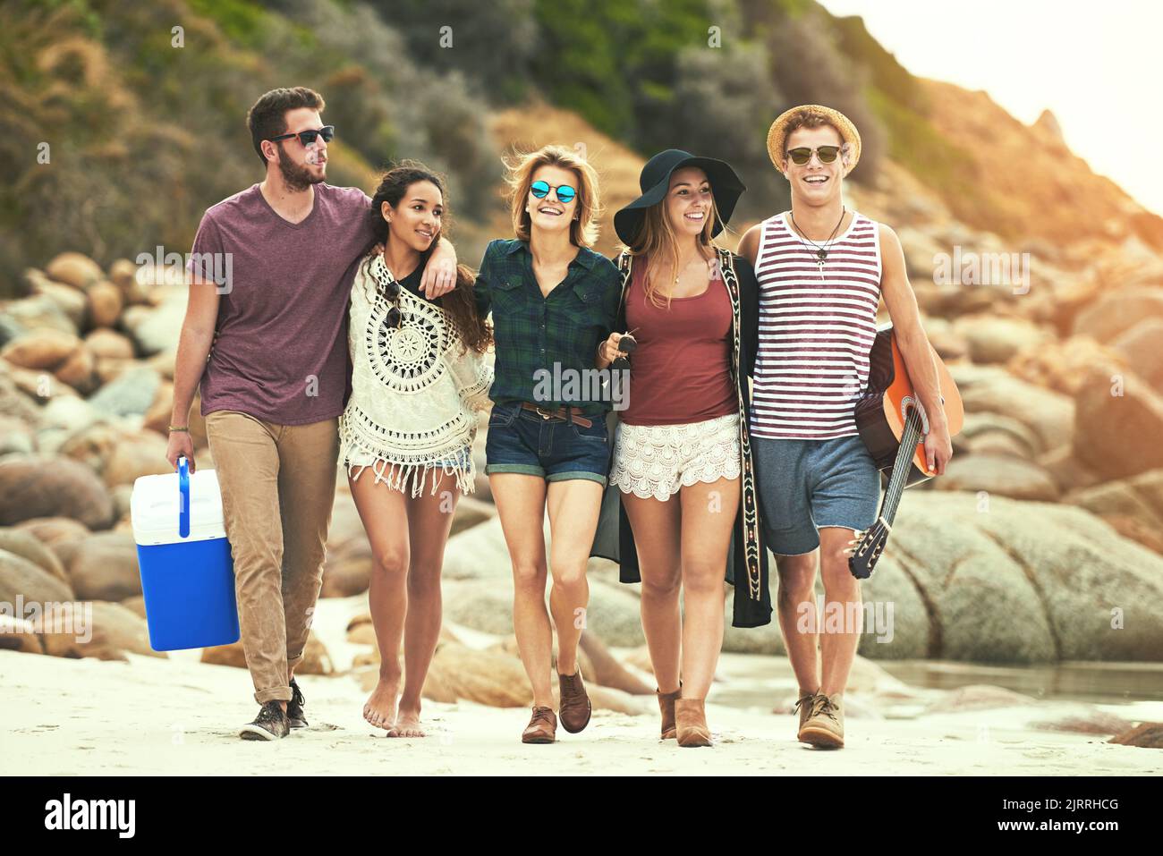 Ready for a day on the beach. Full length shot of a group of friends ...