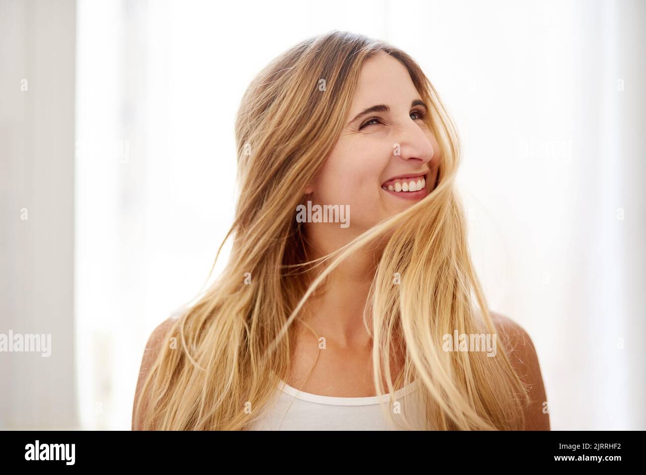 Hair so luscious you cant help but whip it. a beautiful young woman ...