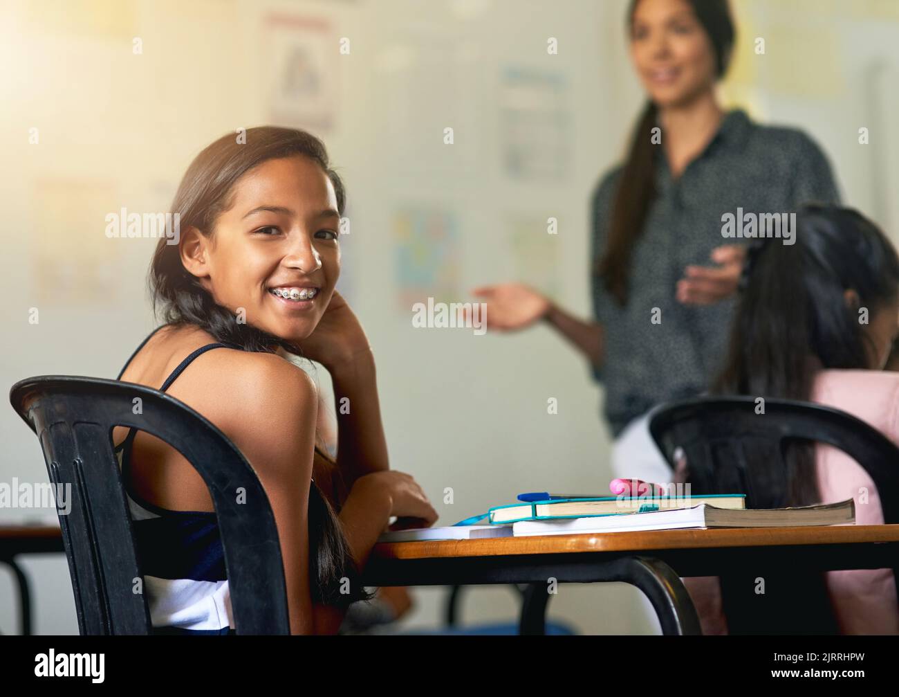 Young schoolgirl with teacher hi-res stock photography and images - Alamy