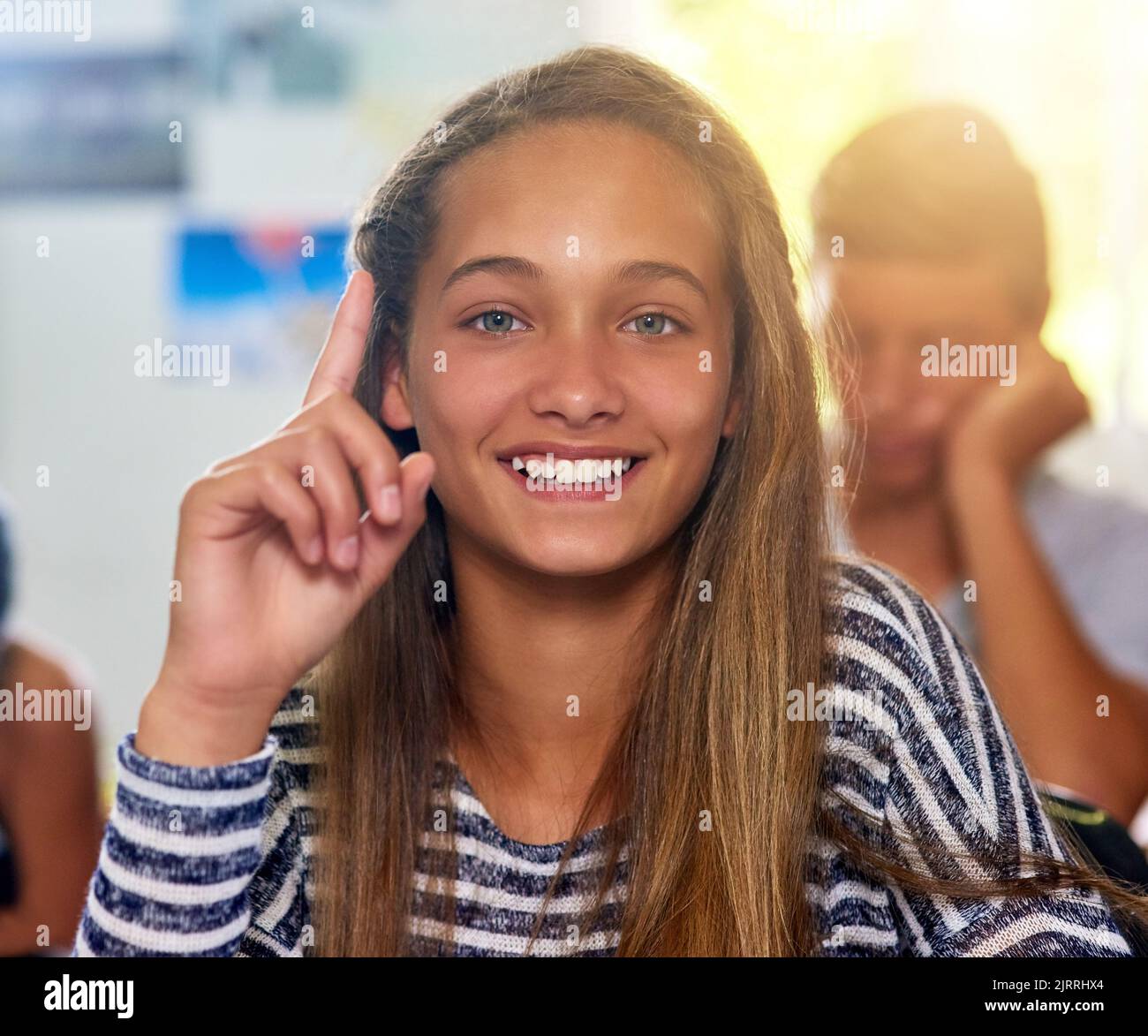 Kids raising hands in class hi-res stock photography and images - Alamy