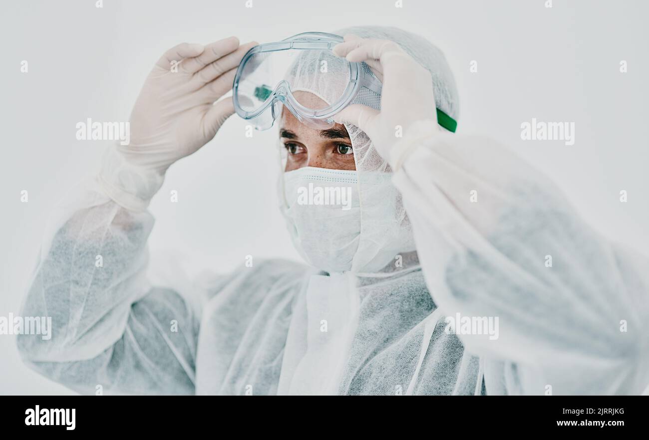 Covid, healthcare worker with safety protection clothing during first ...