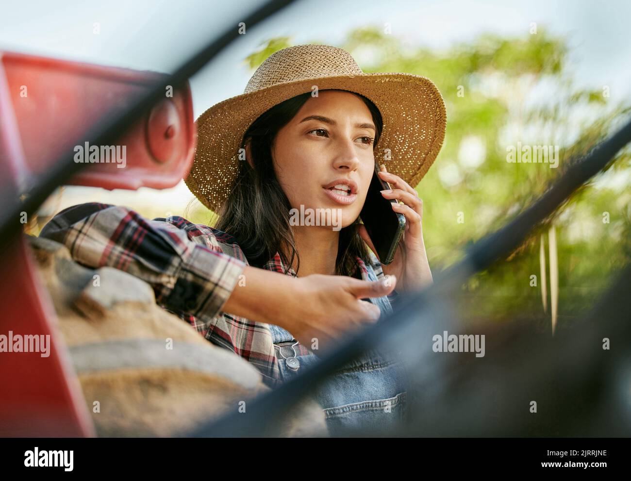 Sustainability farmer, worker and woman on a phone talking and planning ...