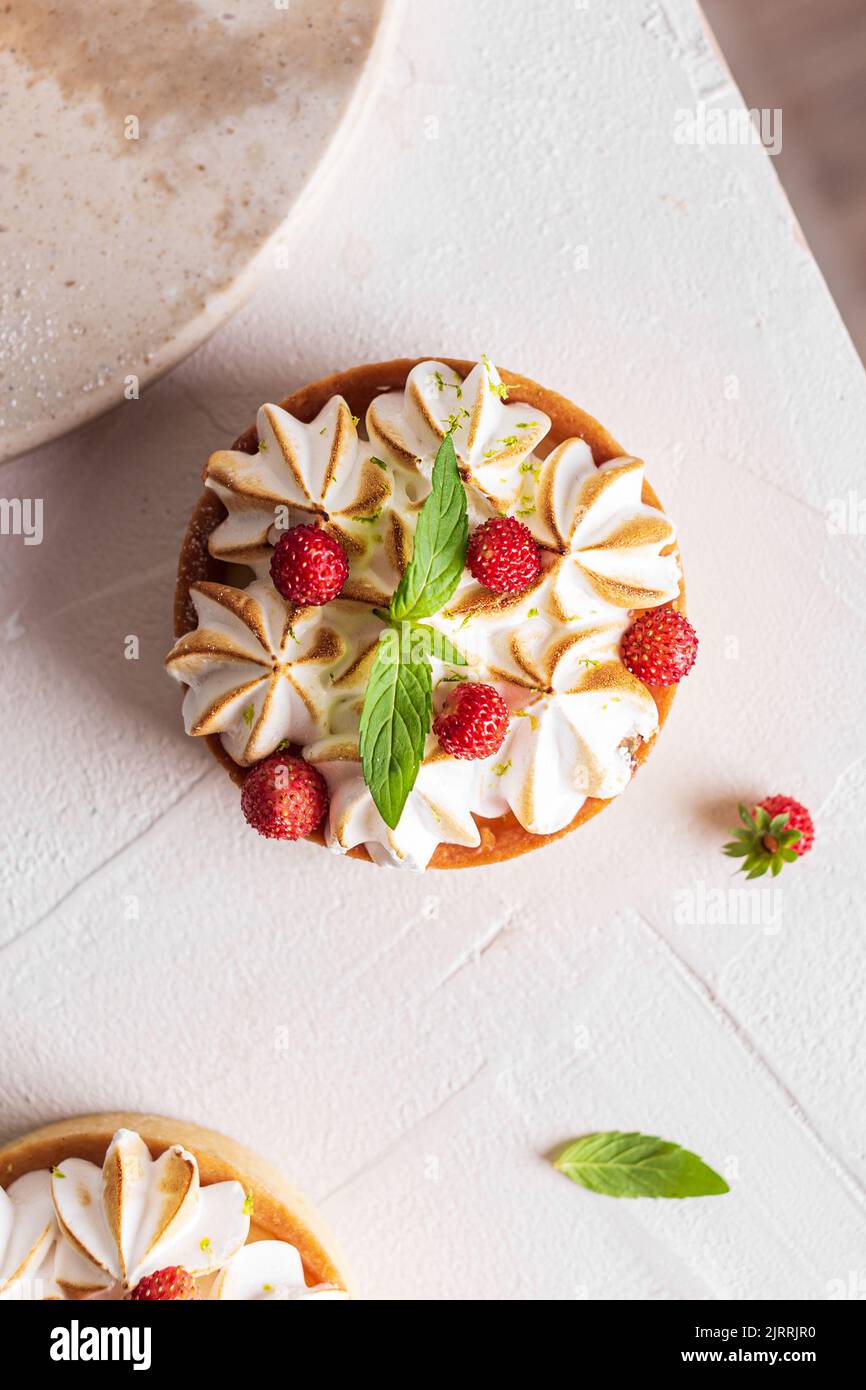 Close up of lemon cakes with berries Stock Photo - Alamy