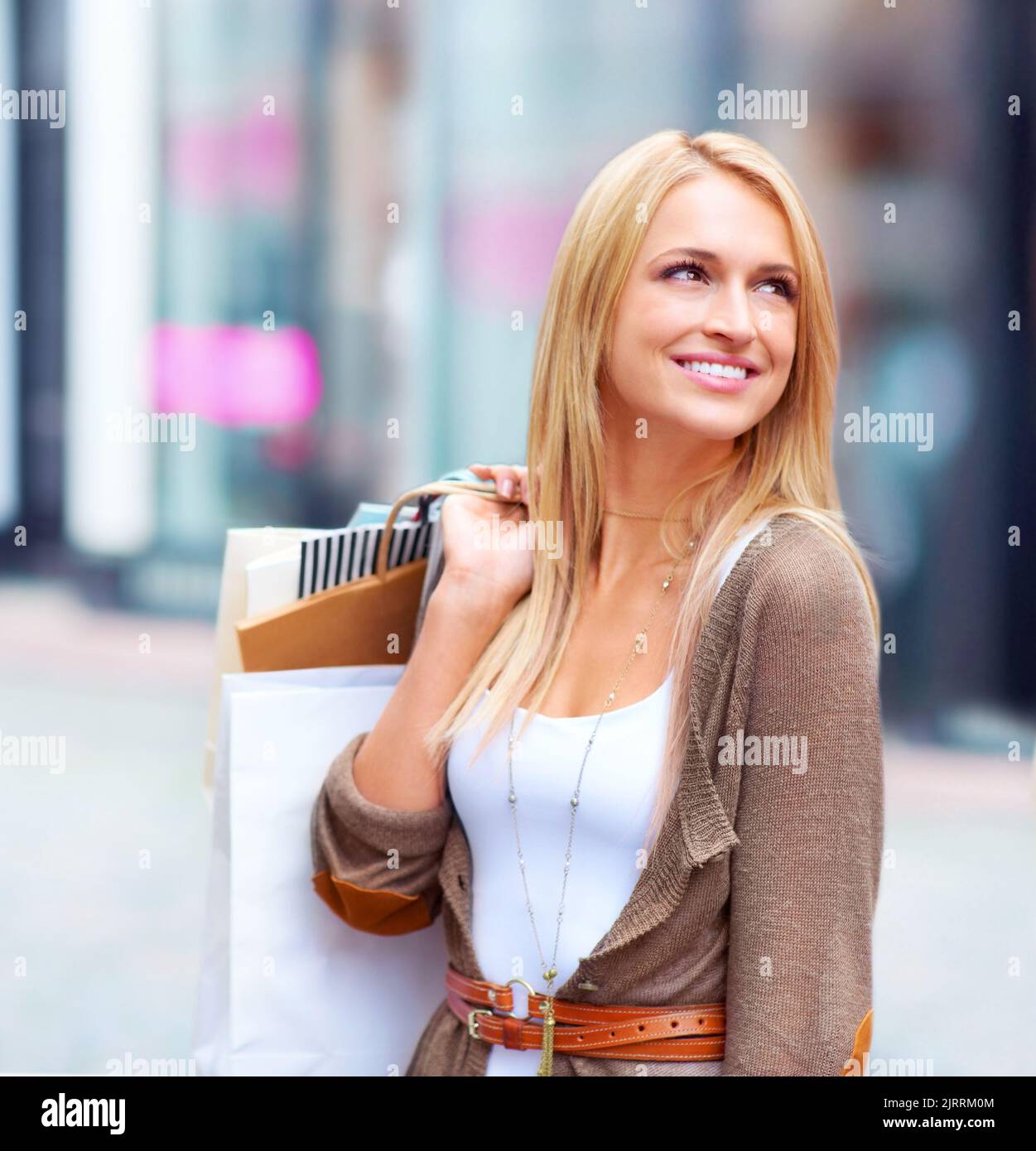 Fashion, happy and woman shopping in the city in designer retail stores ...