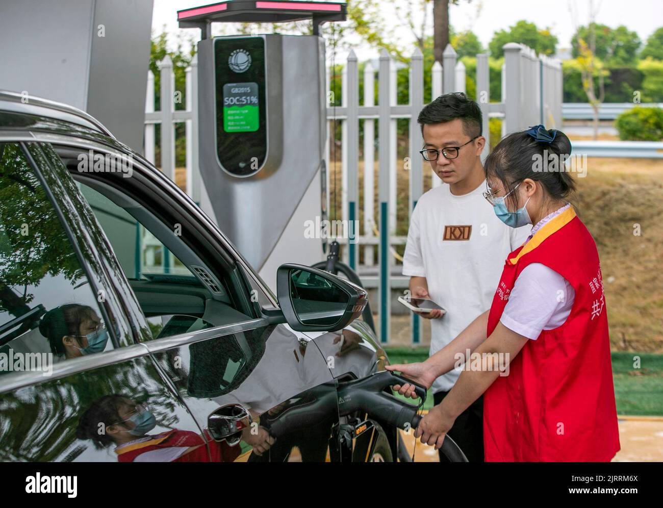 TAIZHOU, CHINA - AUGUST 26, 2022 - An electric vehicle is charged at a ...